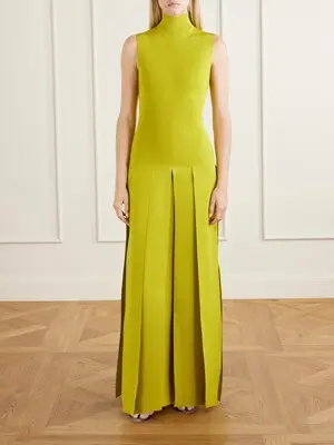 Alaïa Knitted Jersey High Neck Maxi Dress With Pleated Skirt