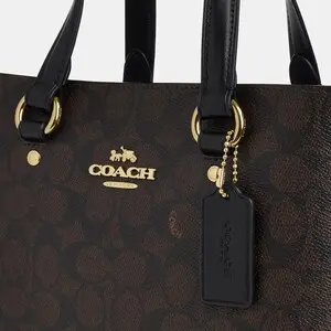 COACH OUTLET Station Carryall Bag In Signature Canvas - Gold/walnut/black
