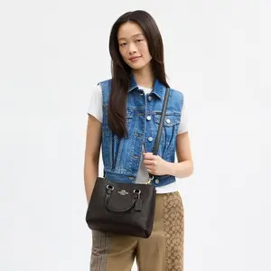 COACH OUTLET Station Carryall Bag In Signature Canvas - Gold/walnut/black