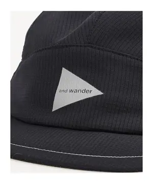 AND WANDER Logo Details On The Ventilated Hat