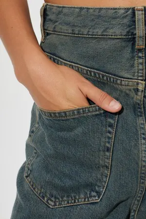 MAISON MARGIELA Asymmetrical Cut Jeans