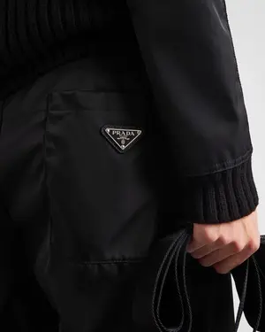 Prada Triangle-logo Mid-rise Tapered-leg Trousers