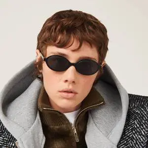 Miu Miu Oval Frame Sunglasses