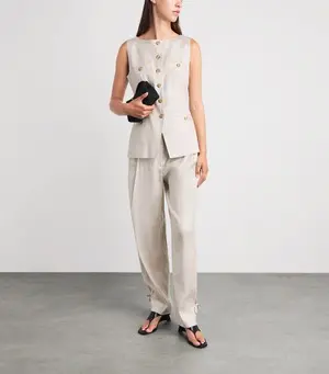 TOCCIN Elowen Linen-blend Trousers With Bow-tie Ankle Detail