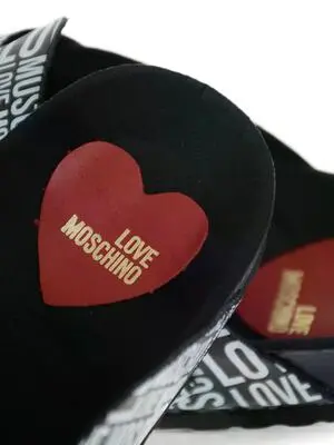 Moschino All-over Logo Print Buckle Sandals
