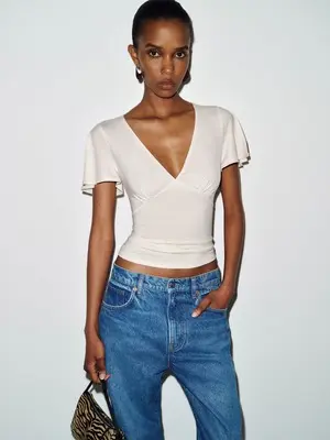 REFORMATION REFORMATION Cosette Flutter Sleeve V-Neck Knit Top