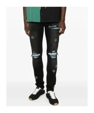Amiri Distressed Jeans With Vintage Effect