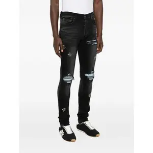 Amiri Distressed Jeans With Vintage Effect