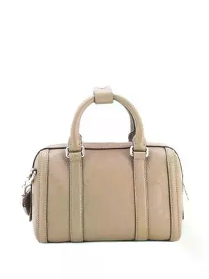 Gucci Jumbo Gg Embossed Leather Mini Travel Bag - Brown