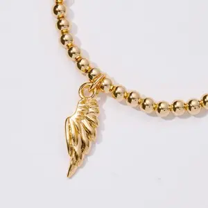 &LIVY Angel Wing Stretch Beaded Bracelet - Gold