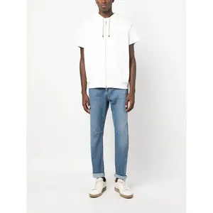 Brunello Cucinelli Tapered Leg Jeans With Logo Patch - Blue