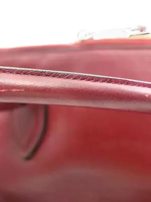 Prada 2000s Logo-embossed Leather Handbag