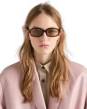 Prada Sunglasses With The Iconic Metal Plaque