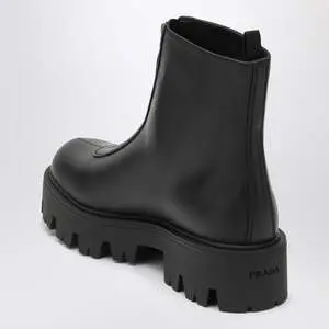 Prada Calfskin Zip-up Ankle Boots With Lug Sole - Black
