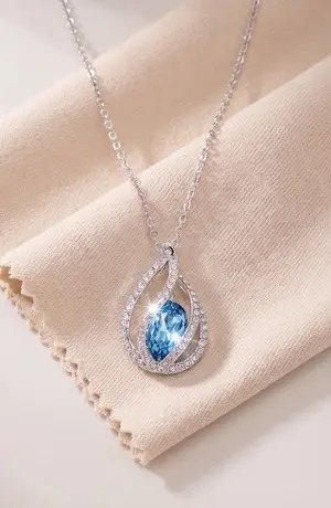 MODENAIRE Crystal Orb Cage Pendant Necklace