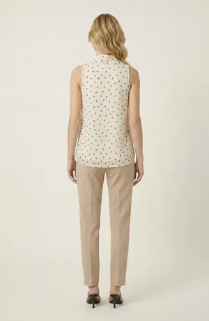 MODENAIRE Sleeveless Tie Neck Polka Dot Blouse