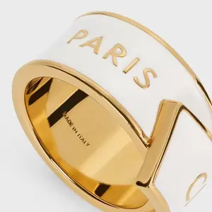 Celine Ribbon Ring In Enamel And Brass With Gold Finish