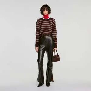 Sandro Distressed Leather Flared Trousers With Hem Slits