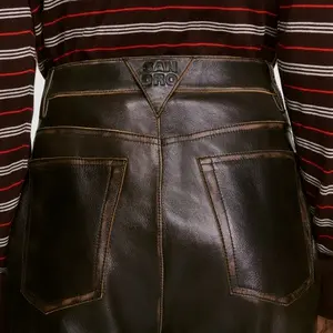 Sandro Distressed Leather Flared Trousers With Hem Slits