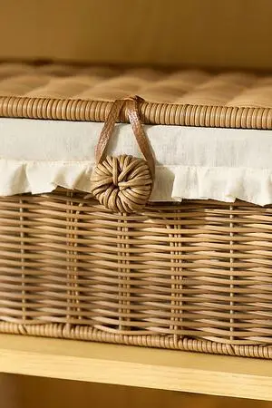 Anthropologie Calista Skirted Faux Rattan Trunk