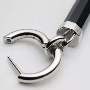 Celine Charms Pendulum Earring In Onyx And Brass With Rhodium Finish
