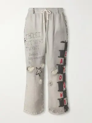 SATOSHI NAKAMOTO Get What I Want Printed Embellished Distressed Cotton-jersey Sweatpants