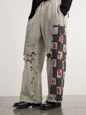 SATOSHI NAKAMOTO Get What I Want Printed Embellished Distressed Cotton-jersey Sweatpants