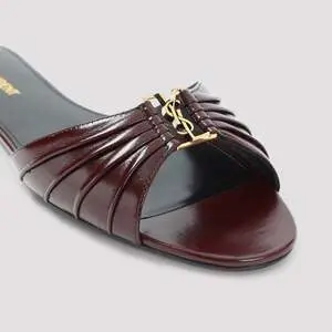 Saint Laurent Babylone" Glossed Leather Flat Sandals With Cassandre Logo