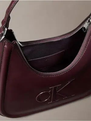 Calvin Klein Embossed Monogram Crescent Bag - Fudge