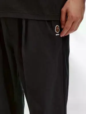 FINGERCROXX Logo-patch Pleated Trousers