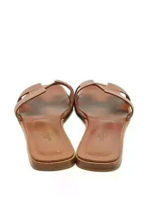 Hermès Oran Cutout Leather Slides - Brown