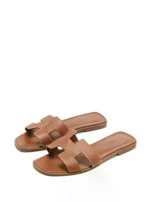 Hermès Oran Cutout Leather Slides - Brown