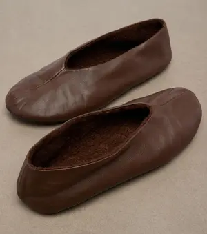 THE ROW Stella Shearling-trimmed Leather Ballet Flats