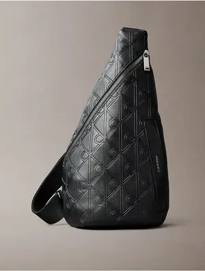 Calvin Klein Debossed Allover Emblem Logo Sling Bag - Black