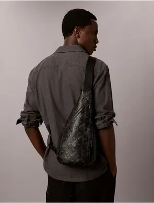 Calvin Klein Debossed Allover Emblem Logo Sling Bag