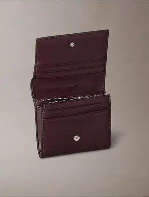Calvin Klein Embossed Monogram Bifold Wallet - Fudge