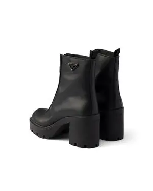 Prada Leather Ankle Boots With Zipper And Lug Sole