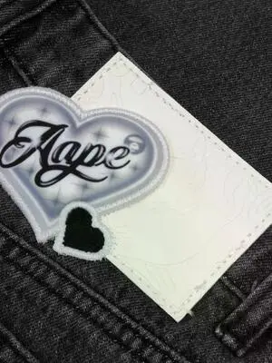 AAPE BY *A BATHING APE Moonface Patch Distressed Jeans