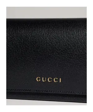 Gucci Leather Pouch With Gold-foiled Logo - Black