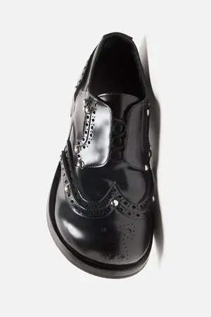 Acne Studios Wingtip Lace-up Shoes With Stud Detailing