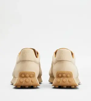 TOD'S Sneakers With Embossed Logo Detail