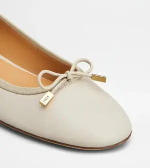 TOD'S Ballerina Flats With Bow Detail And Metal Logo Accent