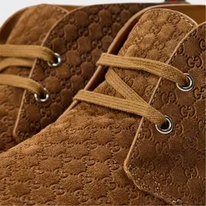 Gucci Logo Embossed Ankle Boots
