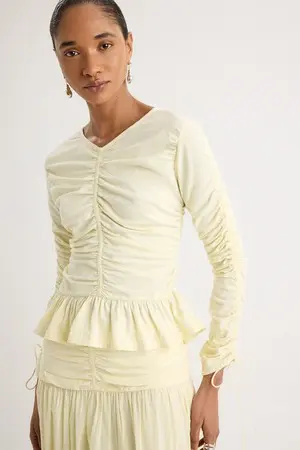 Merlette Arena Ruched Peplum Top With Drawcord Sleeves