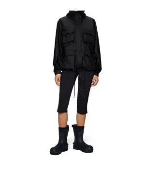 Rains Hooded Long-sleeved Raincoat With Snap Closure And Multiple Pockets