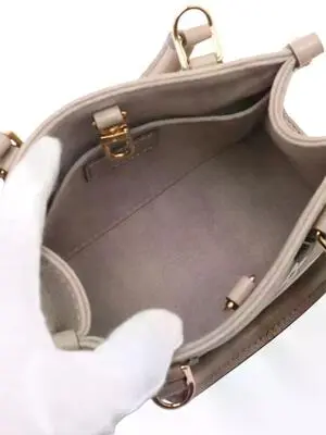 LOUIS VUITTON 2021-2026 Bicolor Monogram Empreinte Giant Onthego Bb Satchel