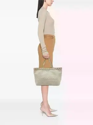 Gucci Monogram Embossed Leather Tote Bag