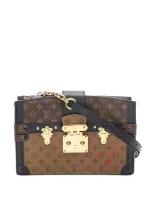 Louis Vuitton Buckled Clutches
