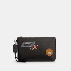 COACH OUTLET Pouch In Signature Canvas With Patches - Silver/walnut/black
