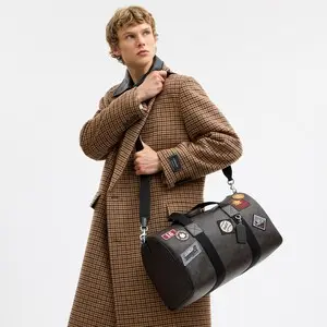 COACH OUTLET Explorer Duffle Bag 45 In Signature Canvas With Patches